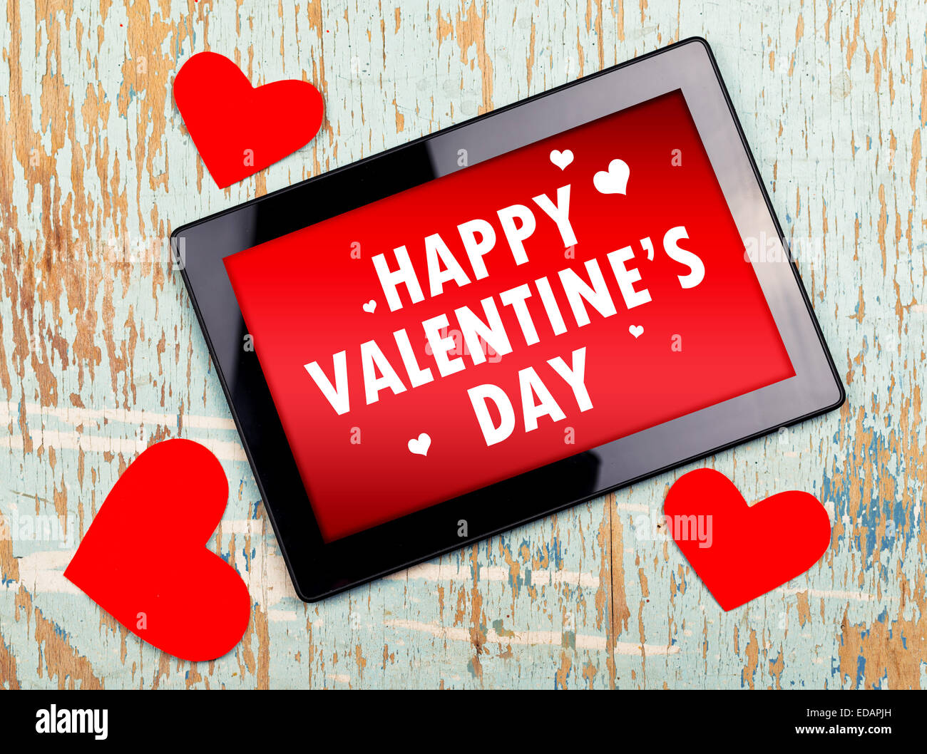 Happy Valentine's Day message on Digital Tablet Computer on old grunge ...