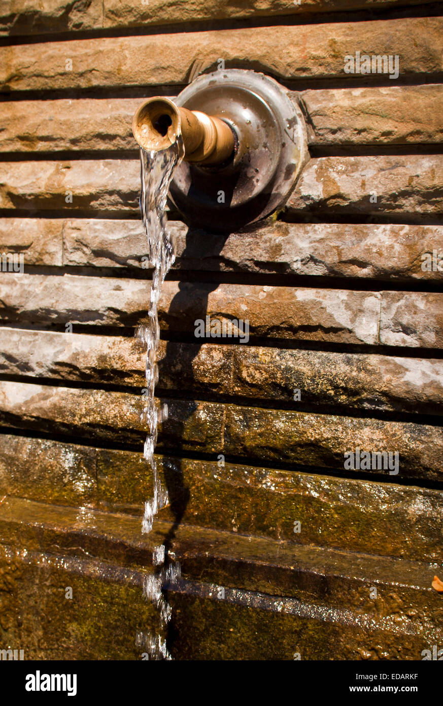Water fountain with fresh water pouring Stock Photo - Alamy