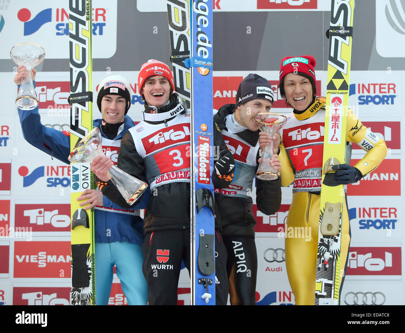 Richard Freitag of Germany (2L) reacts after winning the third stage of ...
