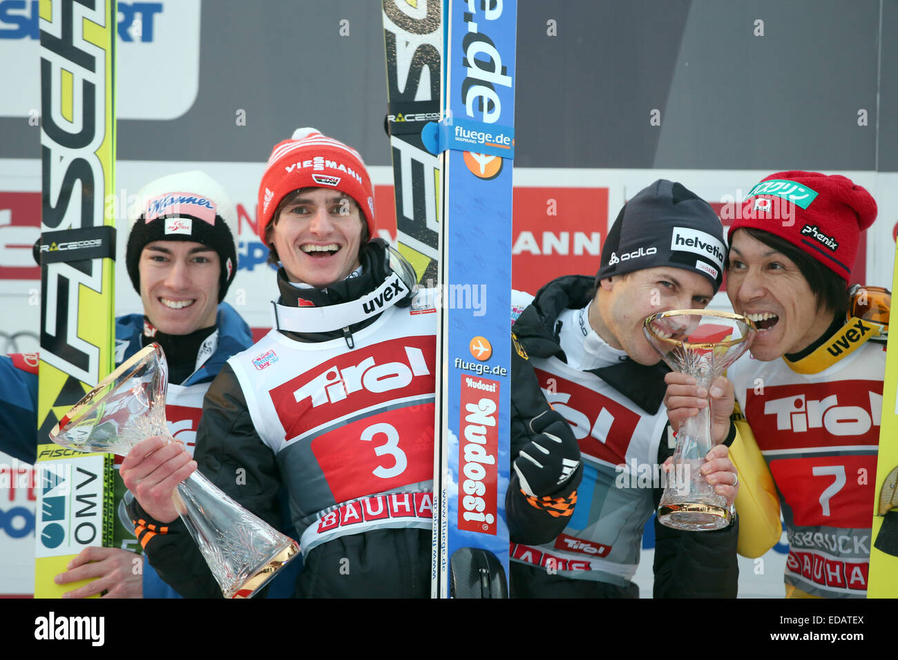 Richard Freitag of Germany (2L) reacts after winning the third stage of ...