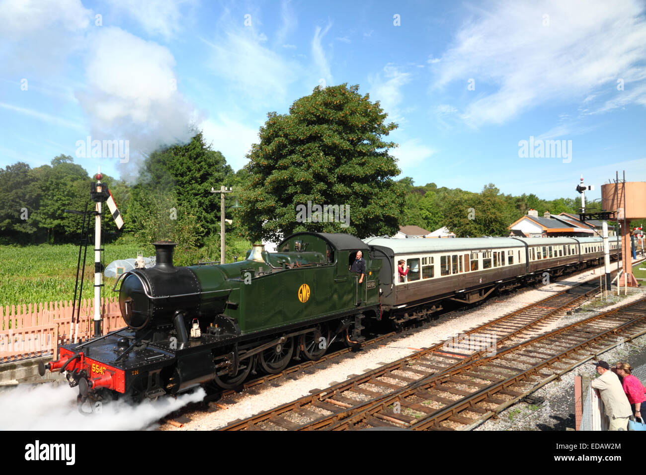 A GWR Locomotive 5542 leaving a country station with a train of ...