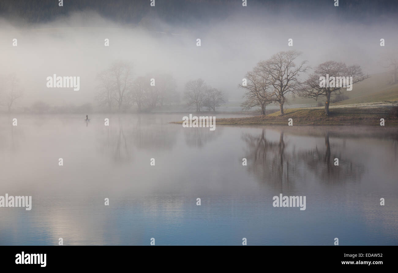 Fishermen on the misty waters of Esthwaite Water, near Hawkshead, Lake ...