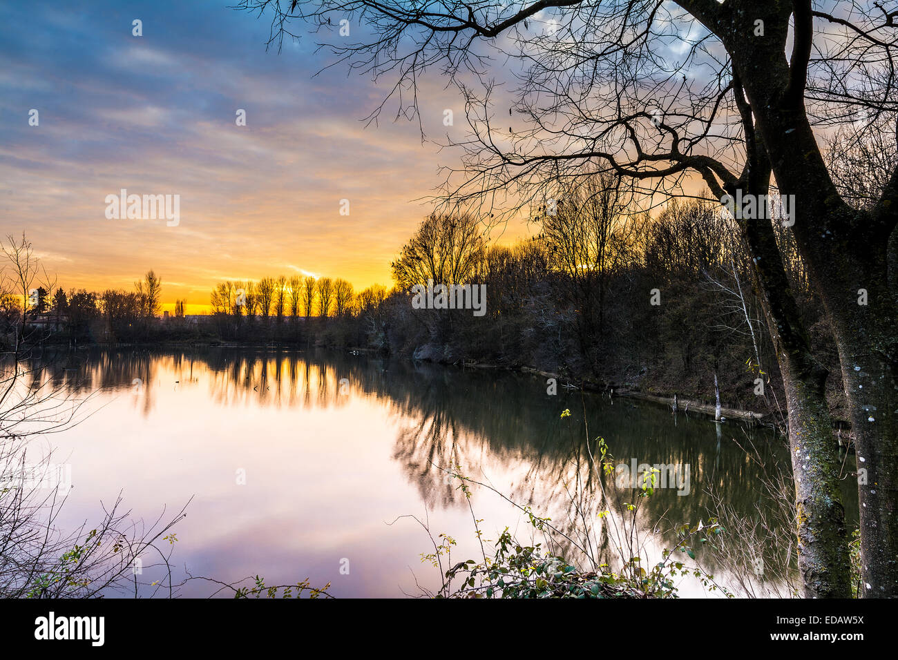 Sunset over a lake in the italy countryside during a winter day Stock ...