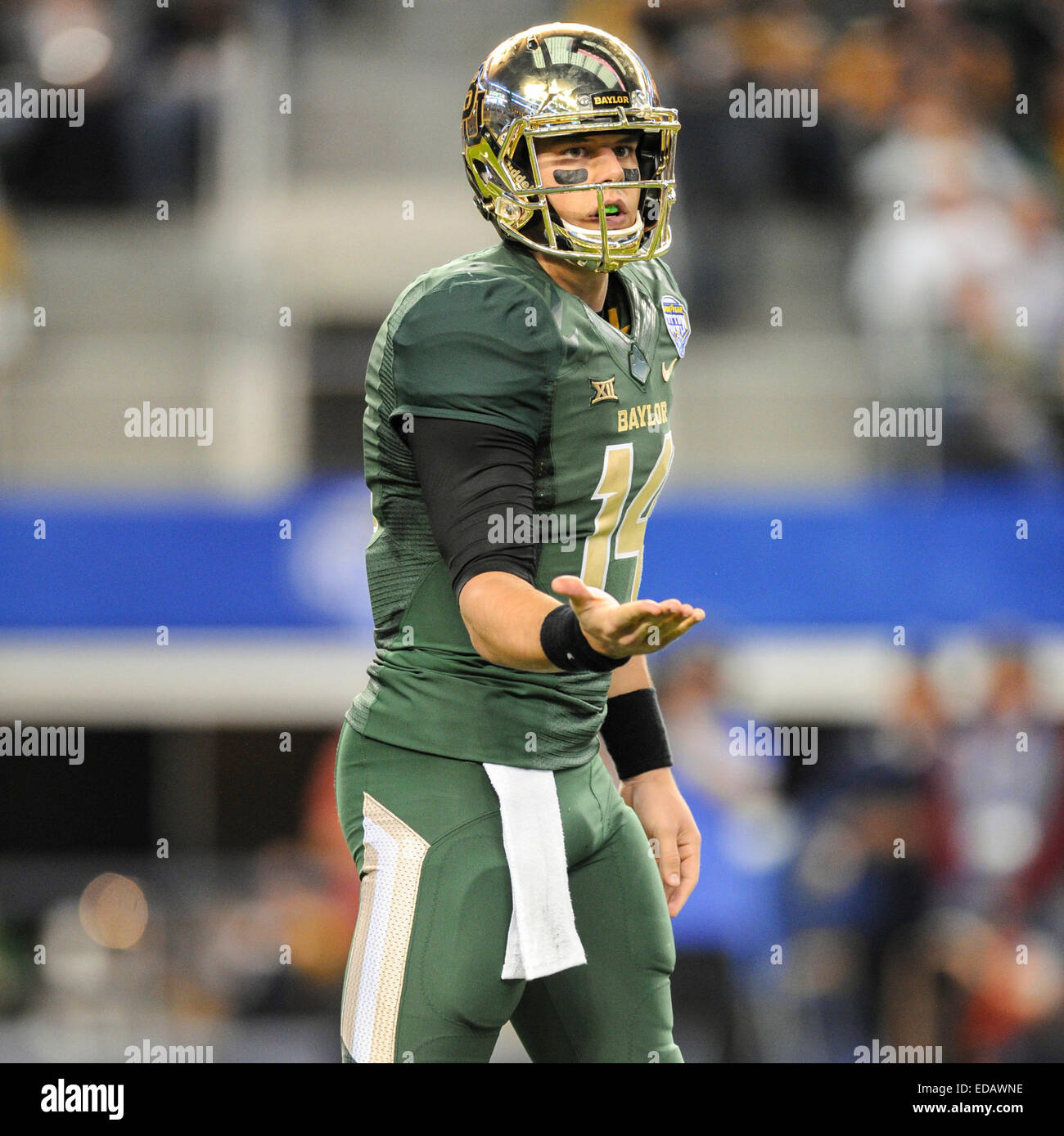 Baylor quarterback Bryce Petty (14) signals to his receivers during the ...