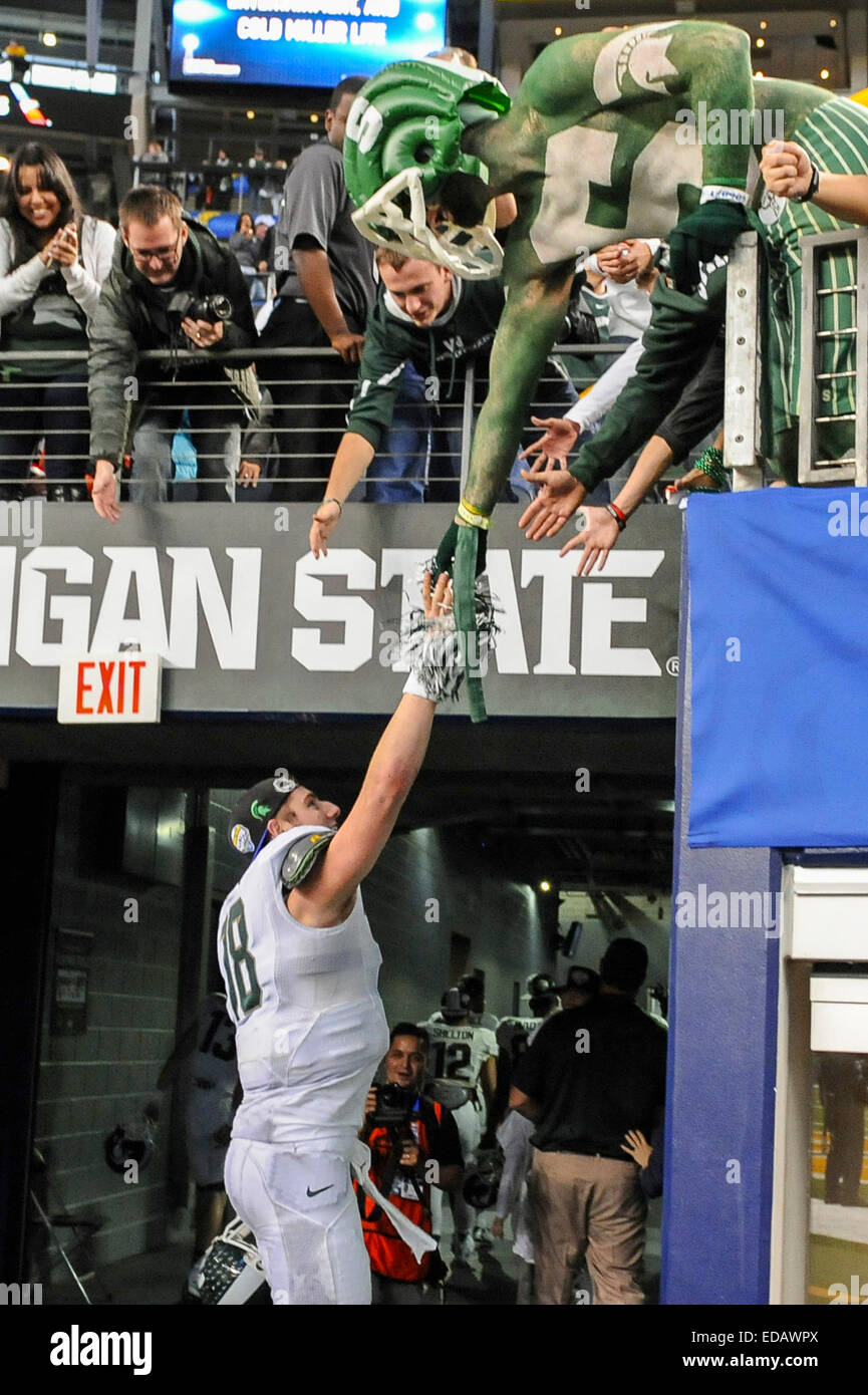 Michigan State Spartans quarterback Connor Cook (18) greets fans as he ...
