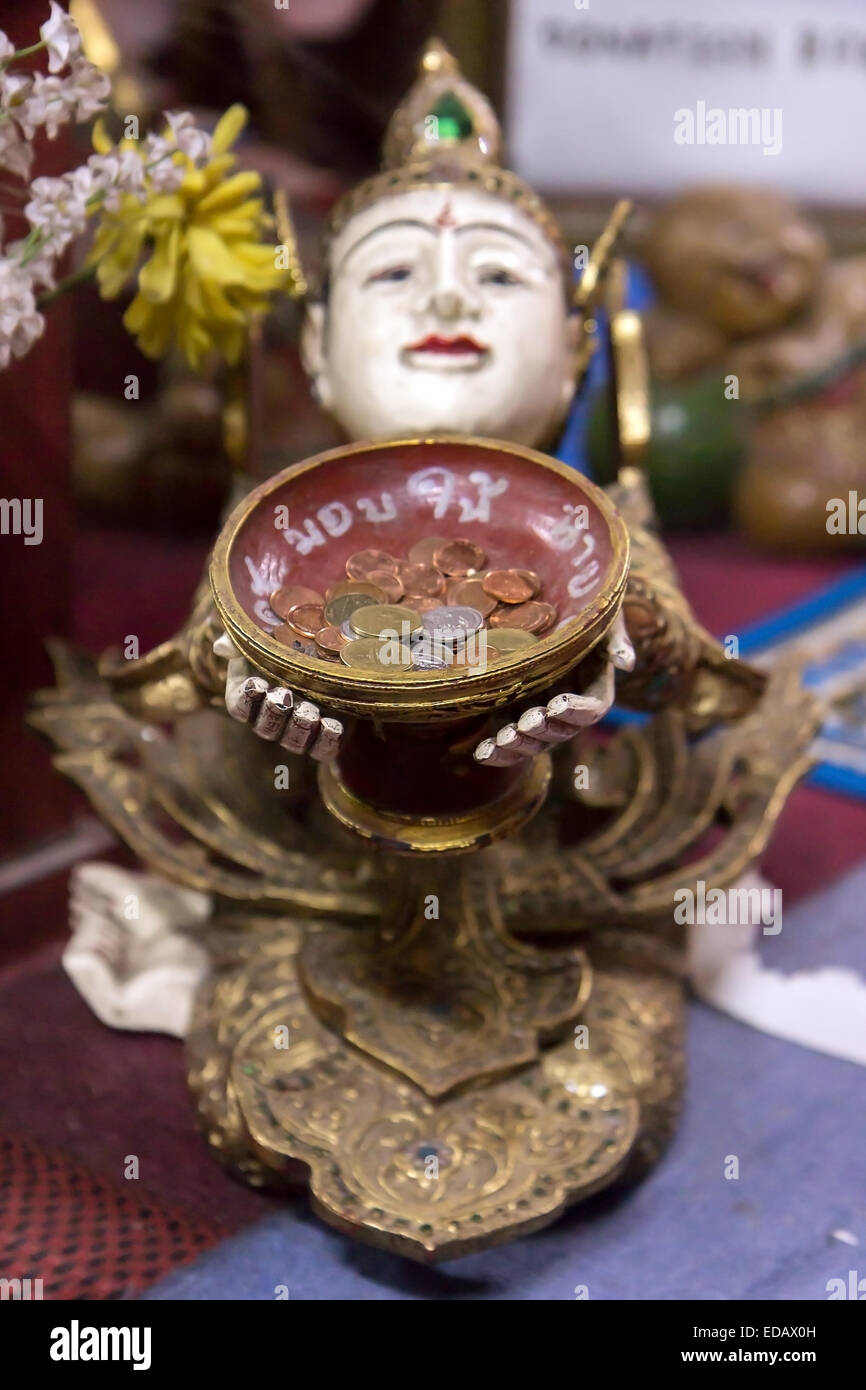 Angel holding coins hi-res stock photography and images - Alamy