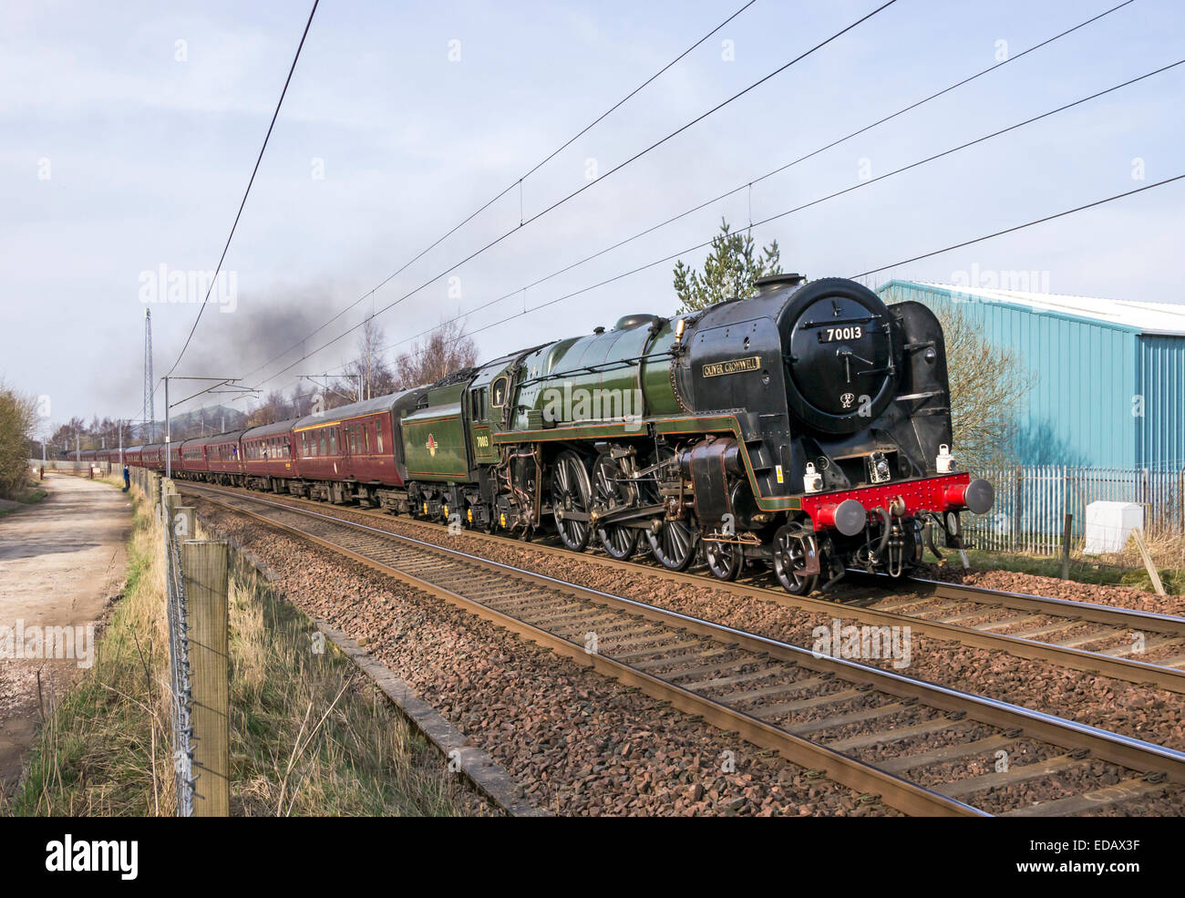 Preserved steam engine 70013 Oliver Cromwell hauls a southbound train ...