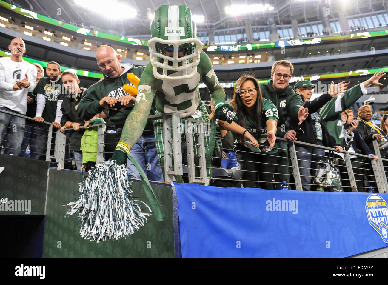Michigan State fans cheer for the Spartans as they head to the locker ...