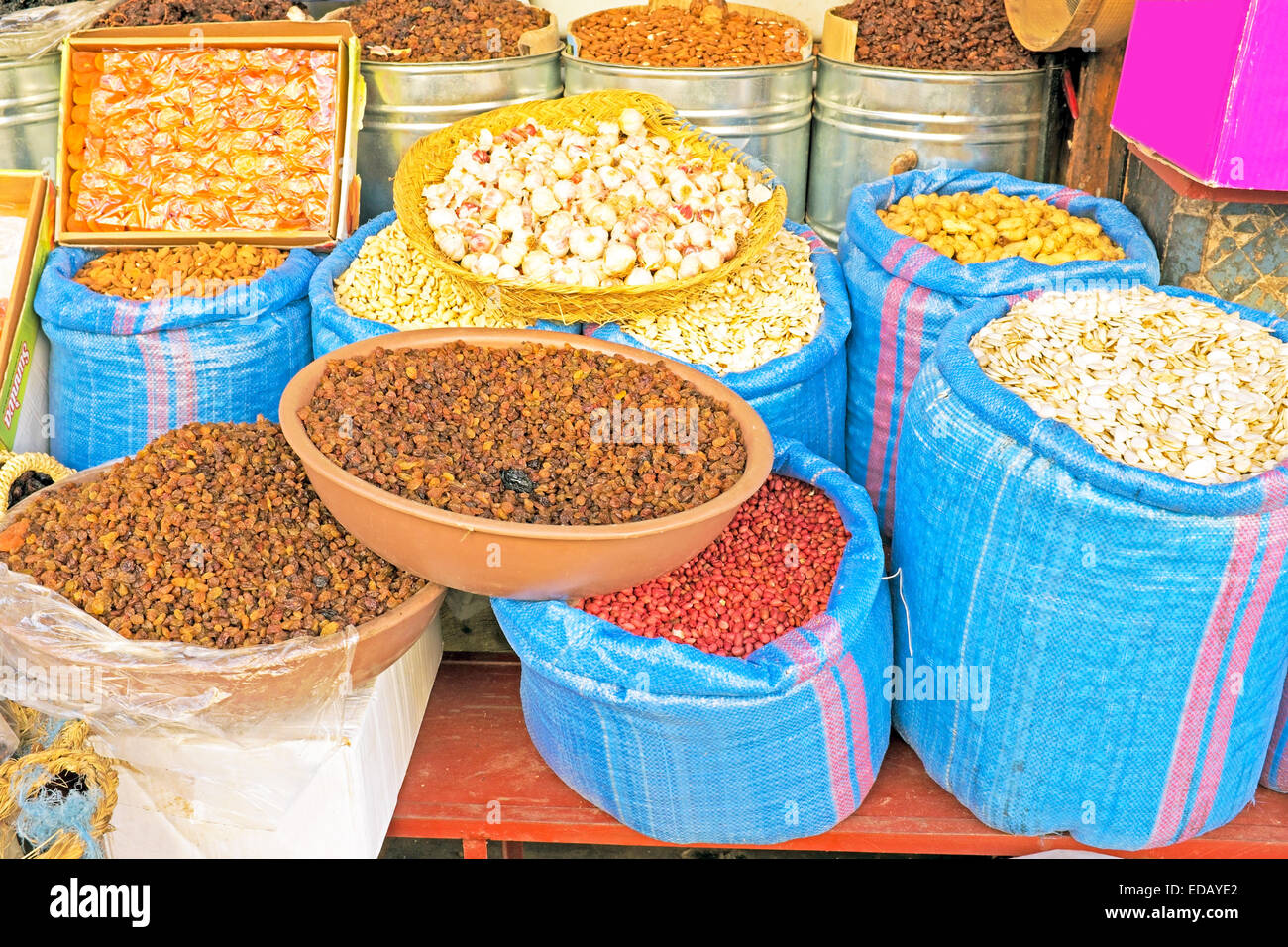Bags of figs, garlic, nuts, peanuts and raisins at a market in Morocco ...