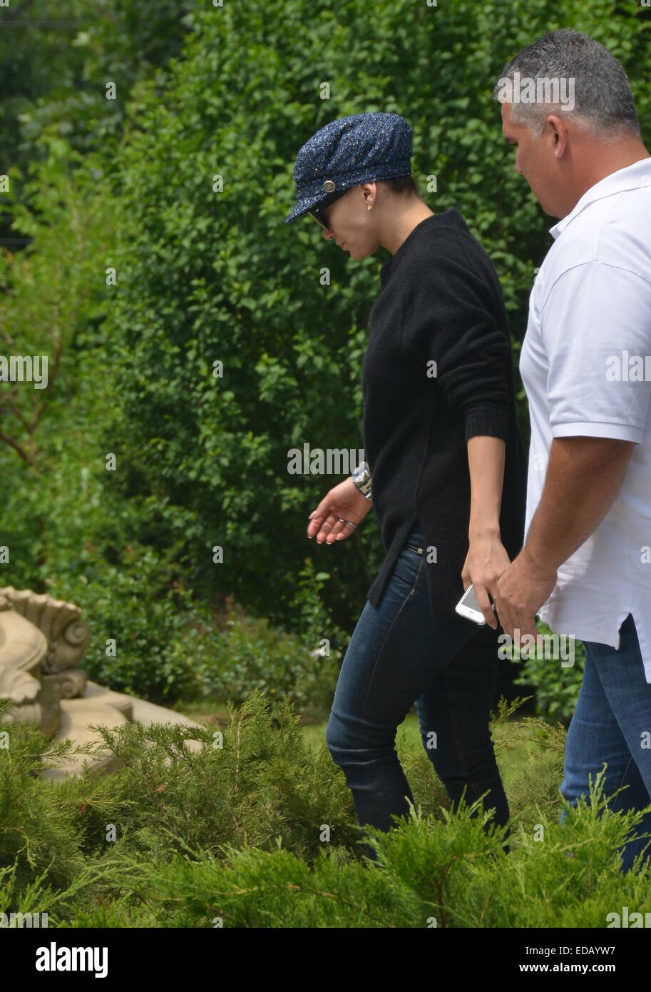 Jennifer Lopez, sporting a retro-style Chanel hat and heavy top despite ...