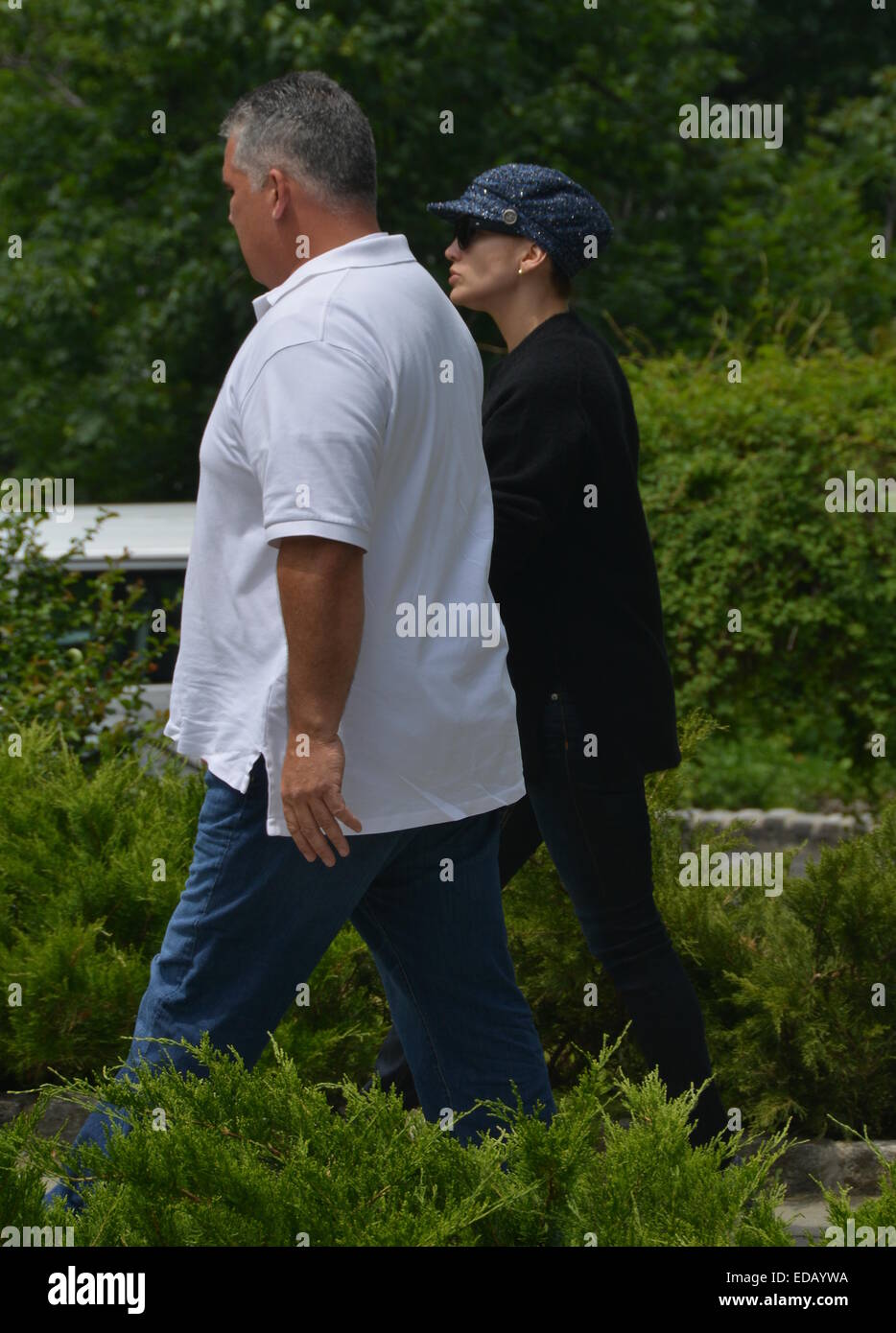 Jennifer Lopez, sporting a retro-style Chanel hat and heavy top despite ...