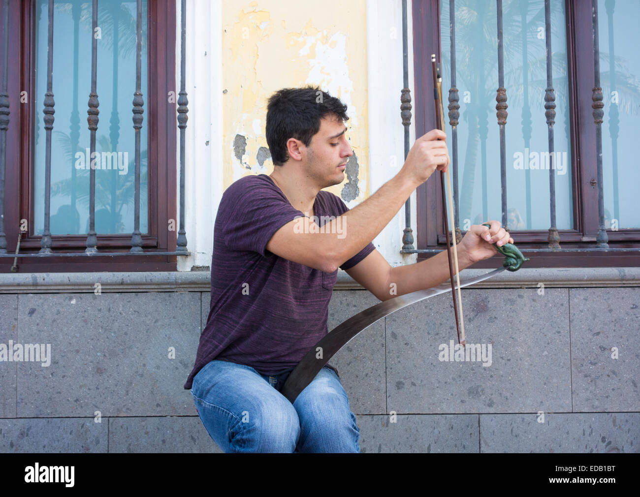 Saw playing hi-res stock photography and images - Alamy
