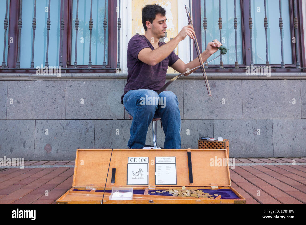 Busker playing Saw in street in Spain Stock Photo - Alamy