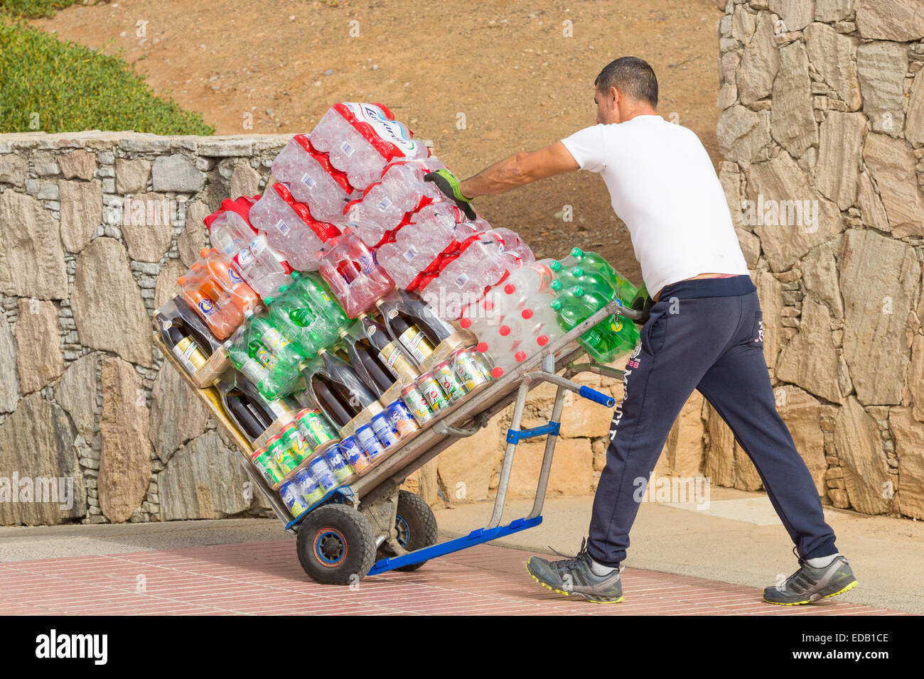 Man delivering soft drinks and alcohol to beach bars in Spain Stock ...