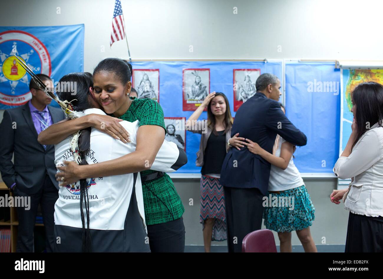 US President Barack Obama and First Lady Michelle Obama hug Native ...