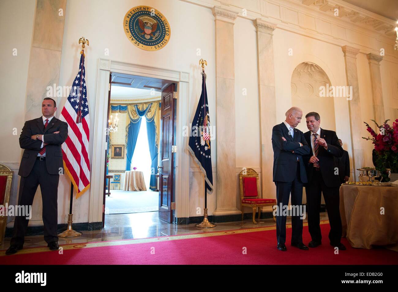 US Vice President Joe Biden talks to Alaska Senator Mark Begich during ...