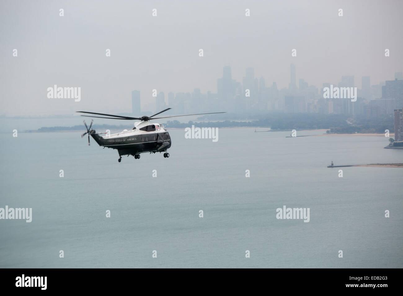 Marine One helicopter carrying President Barack Obama flies over Lake ...