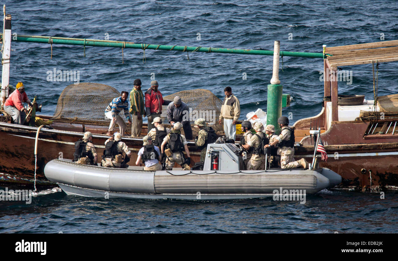A US Navy commandos with a Visit, board, search and seizure team talk ...