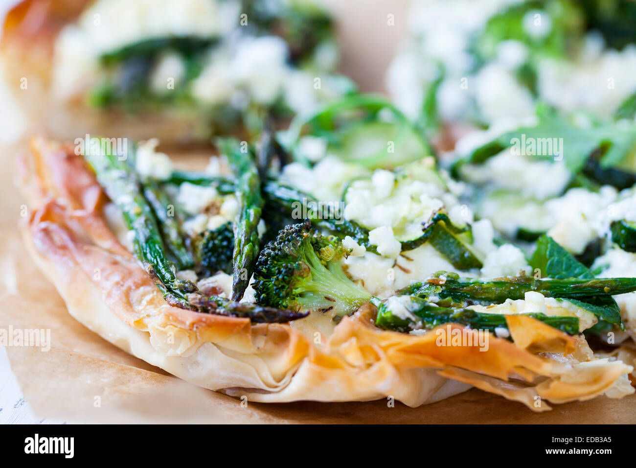 Filo pastry pie with roast green vegetable Stock Photo - Alamy