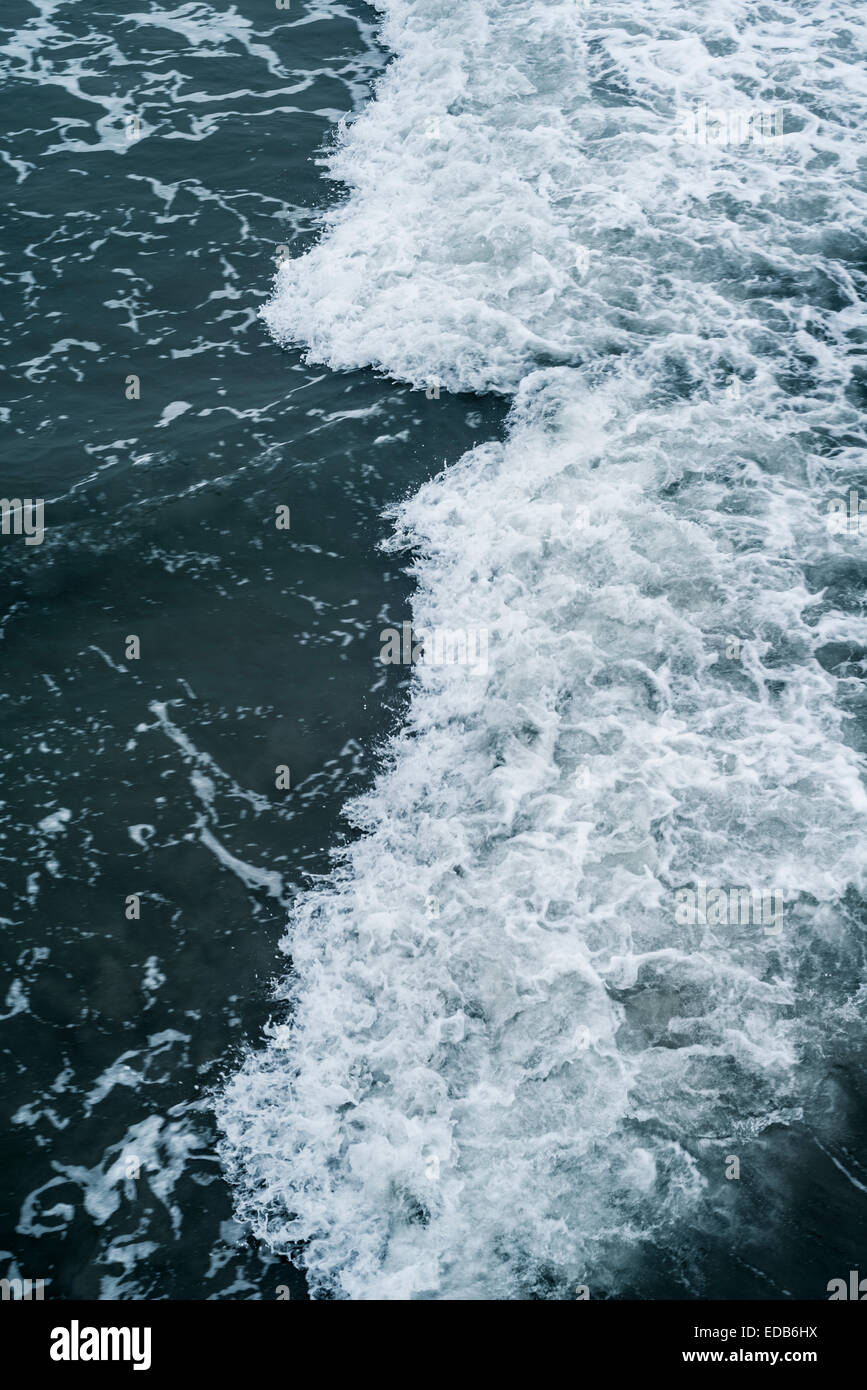 image of waves creating abstract patterns as they break on the shore ...