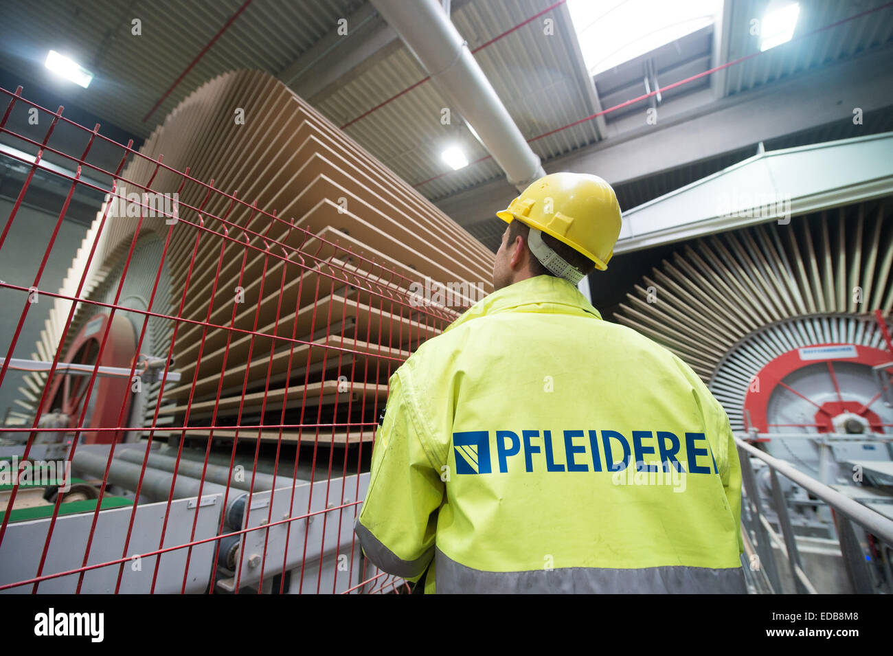 Chipboard plates are produced at the wood processing company Pfleiderer ...