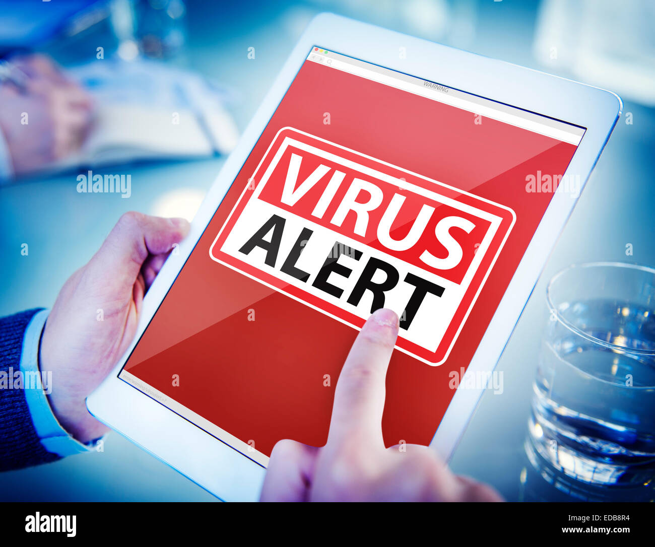Hands Holding Digital Tablet Virus Alert Stock Photo - Alamy