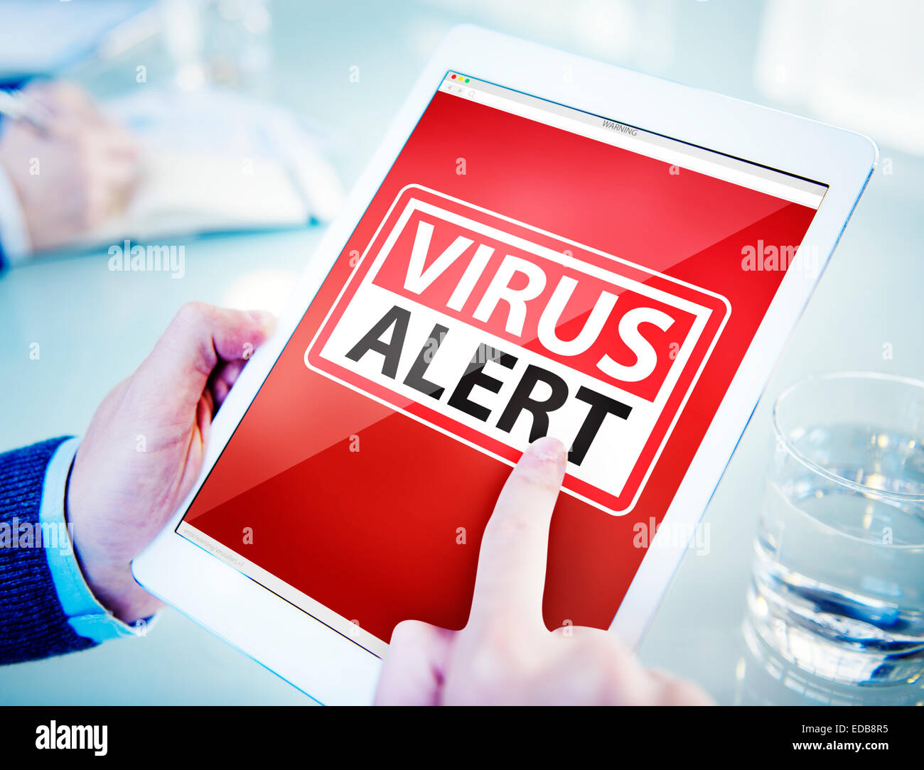 Hands Holding Digital Tablet Virus Alert Stock Photo - Alamy
