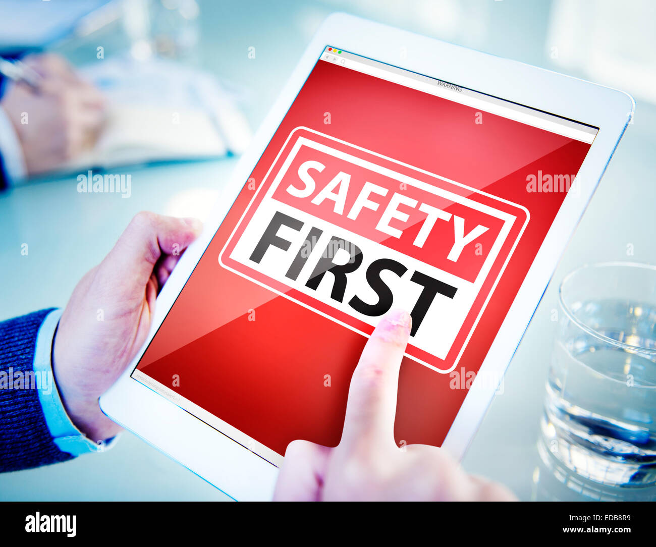 Hands Holding Digital Tablet Safety First Stock Photo - Alamy