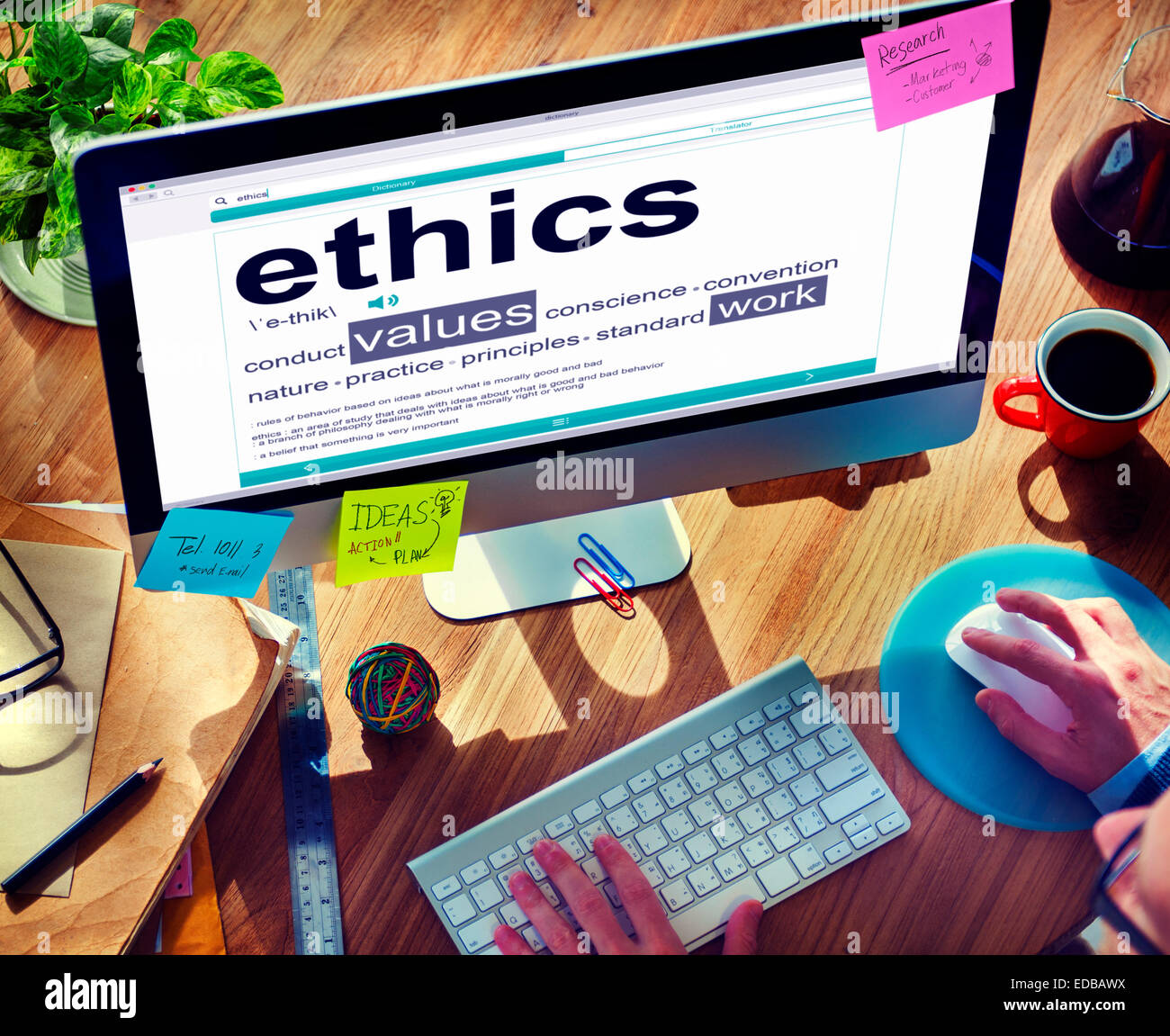 Man Reading the Definition of Ethics Stock Photo - Alamy