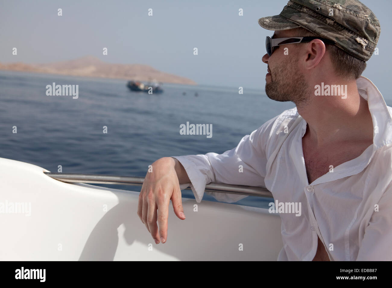 Man looks into the distance Stock Photo - Alamy
