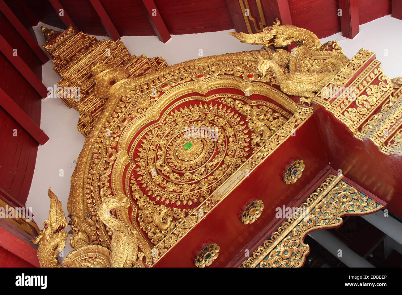 Golden patterns were sculptured on the gate of a Buddhist temple (Wat ...