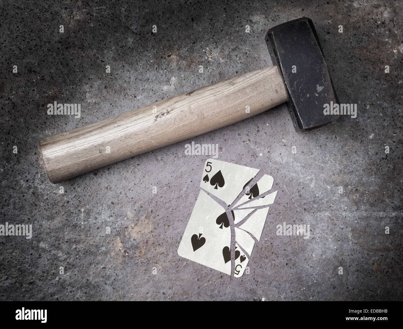 Hammer with a broken card, vintage look, five of spades Stock Photo - Alamy