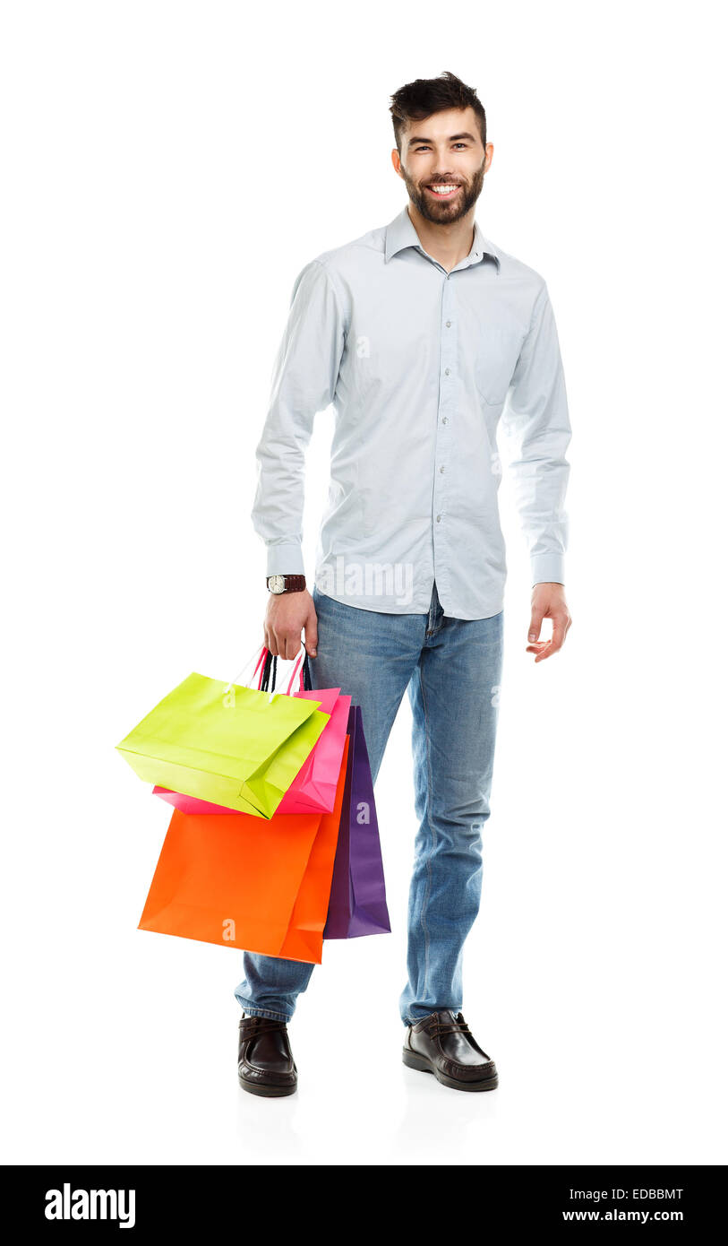Handsome man holding shopping bags. Christmas and holidays concept ...