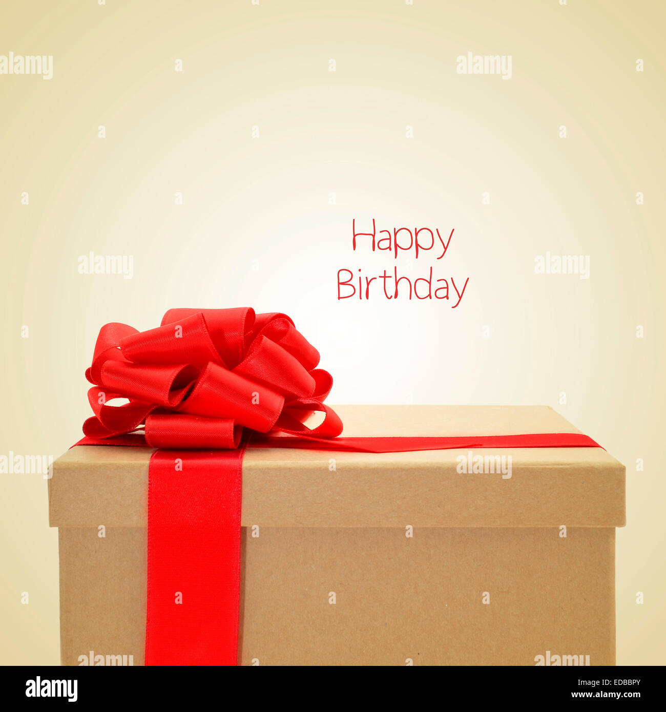 a gift box with a red ribbon bow, and the sentence happy birthday on a ...