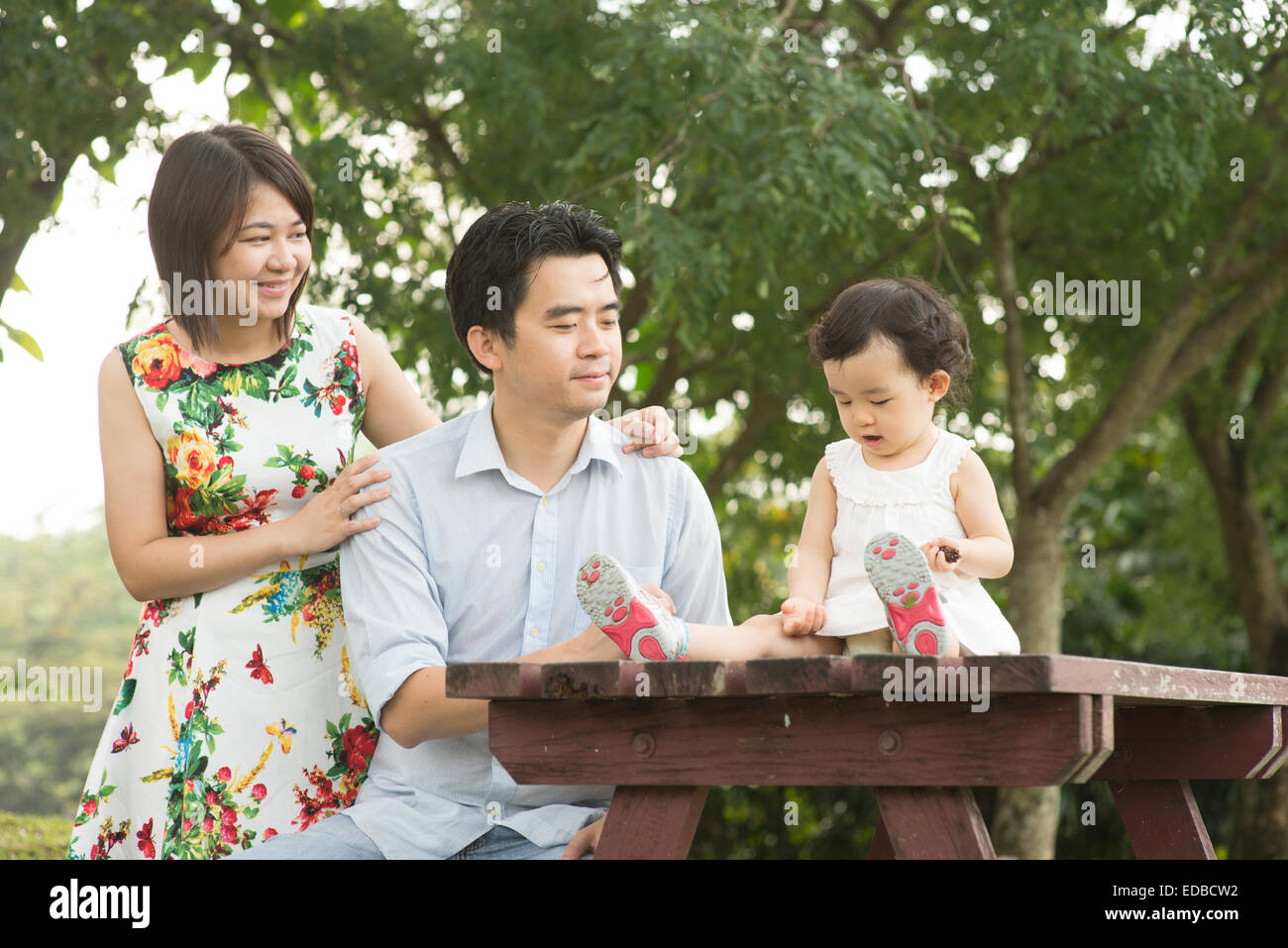 Happy Asian Family enjoying their time in the park Stock Photo - Alamy