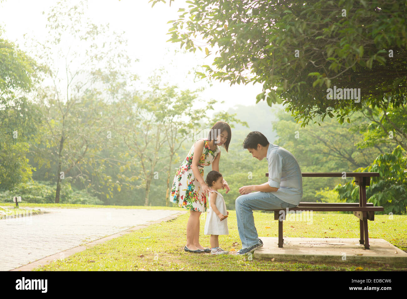Happy Asian Family enjoying their time in the park Stock Photo - Alamy