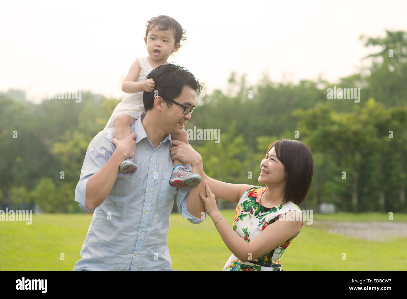 Happy Asian Family enjoying family time together in the park Stock ...