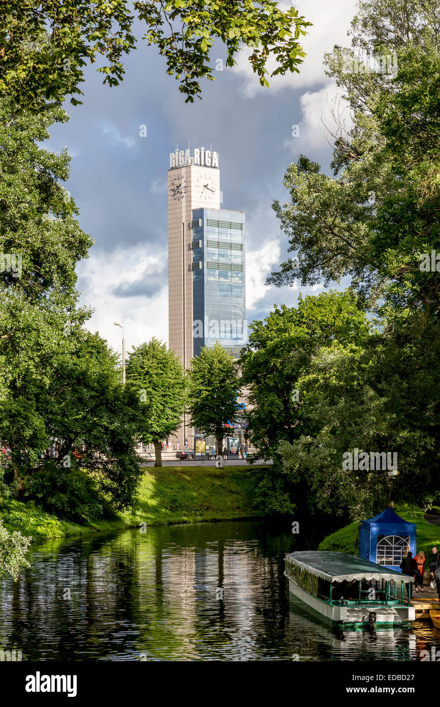 Pilsetas Canal with tower, clock and lettering on the building of Riga ...
