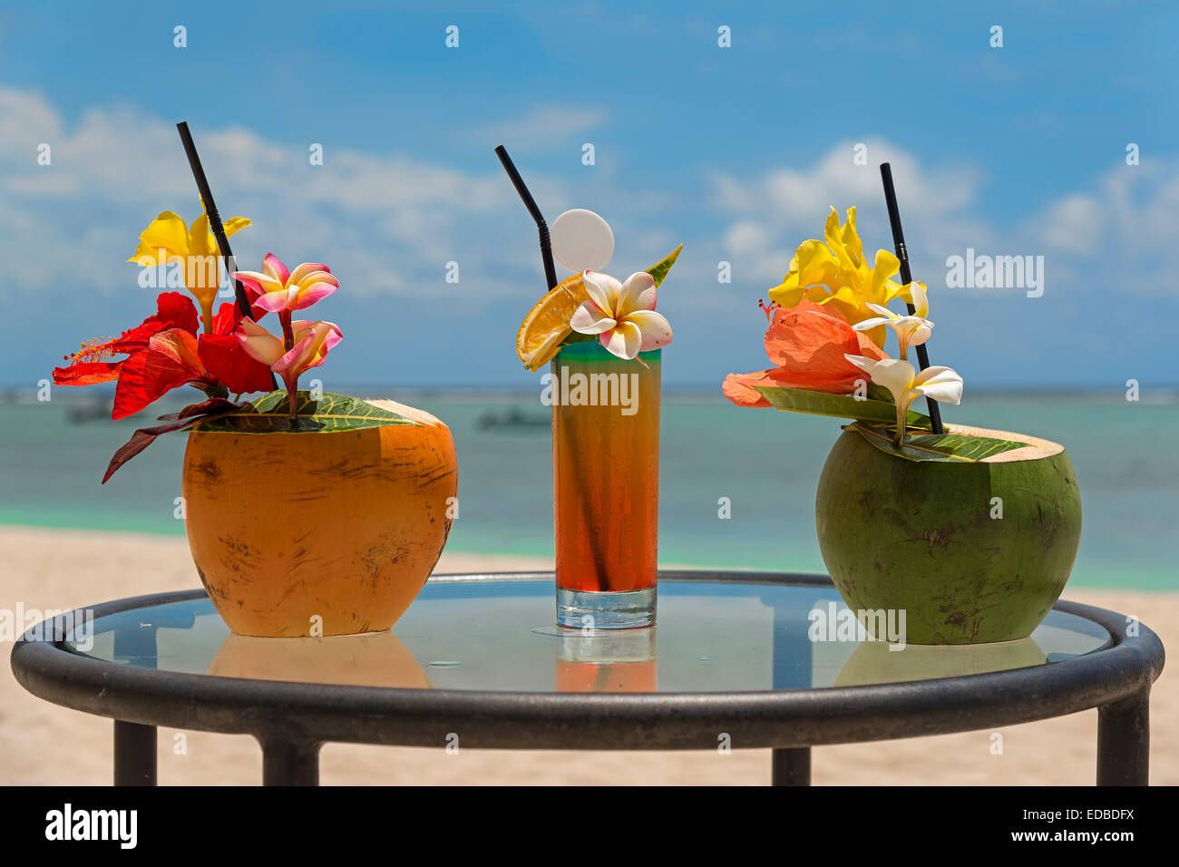 Cocktails served in coconuts, Mauritius Stock Photo - Alamy
