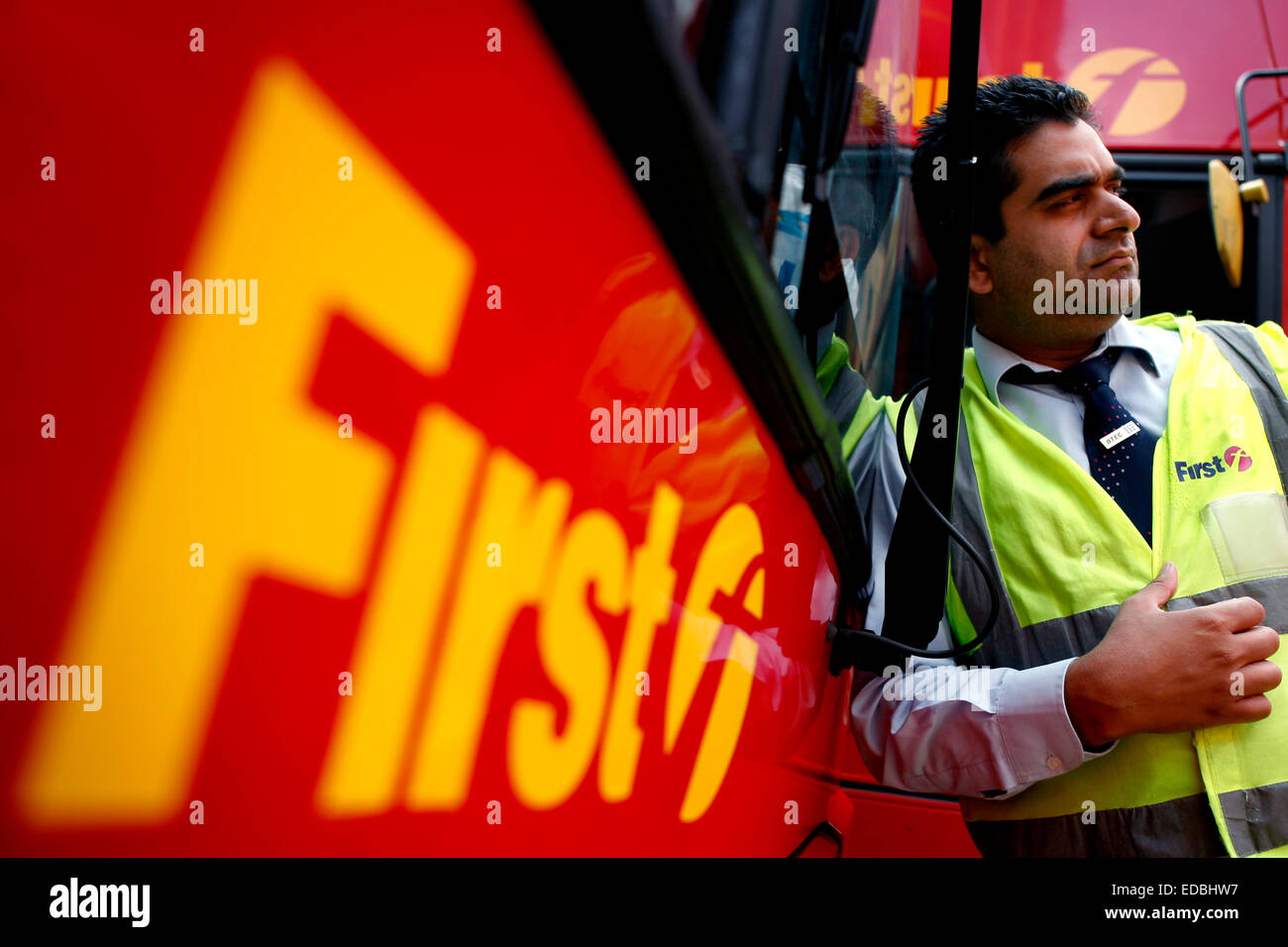 A first group bus driver in high visibility vest hi-res stock ...
