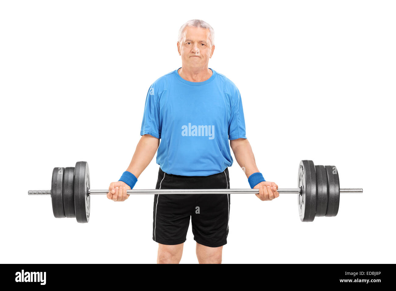 Mature man lifting a heavy barbell isolated on white background Stock ...
