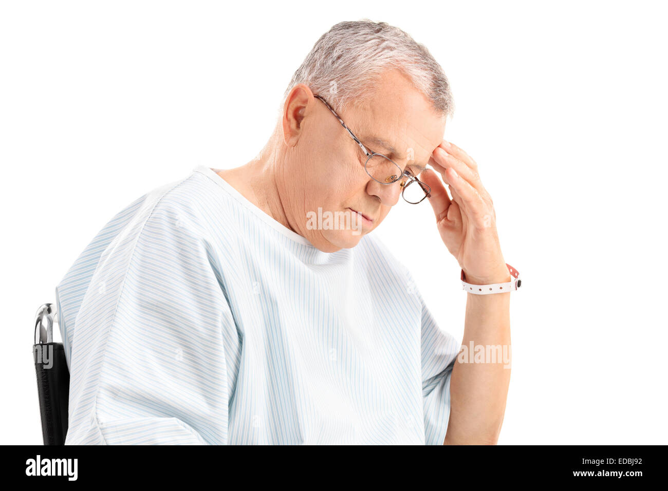 Worried mature patient looking down isolated on white background Stock ...