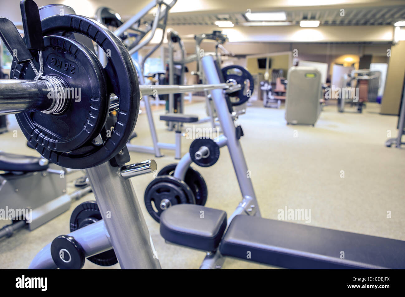 diverse equipment and machines at the gym room Stock Photo - Alamy