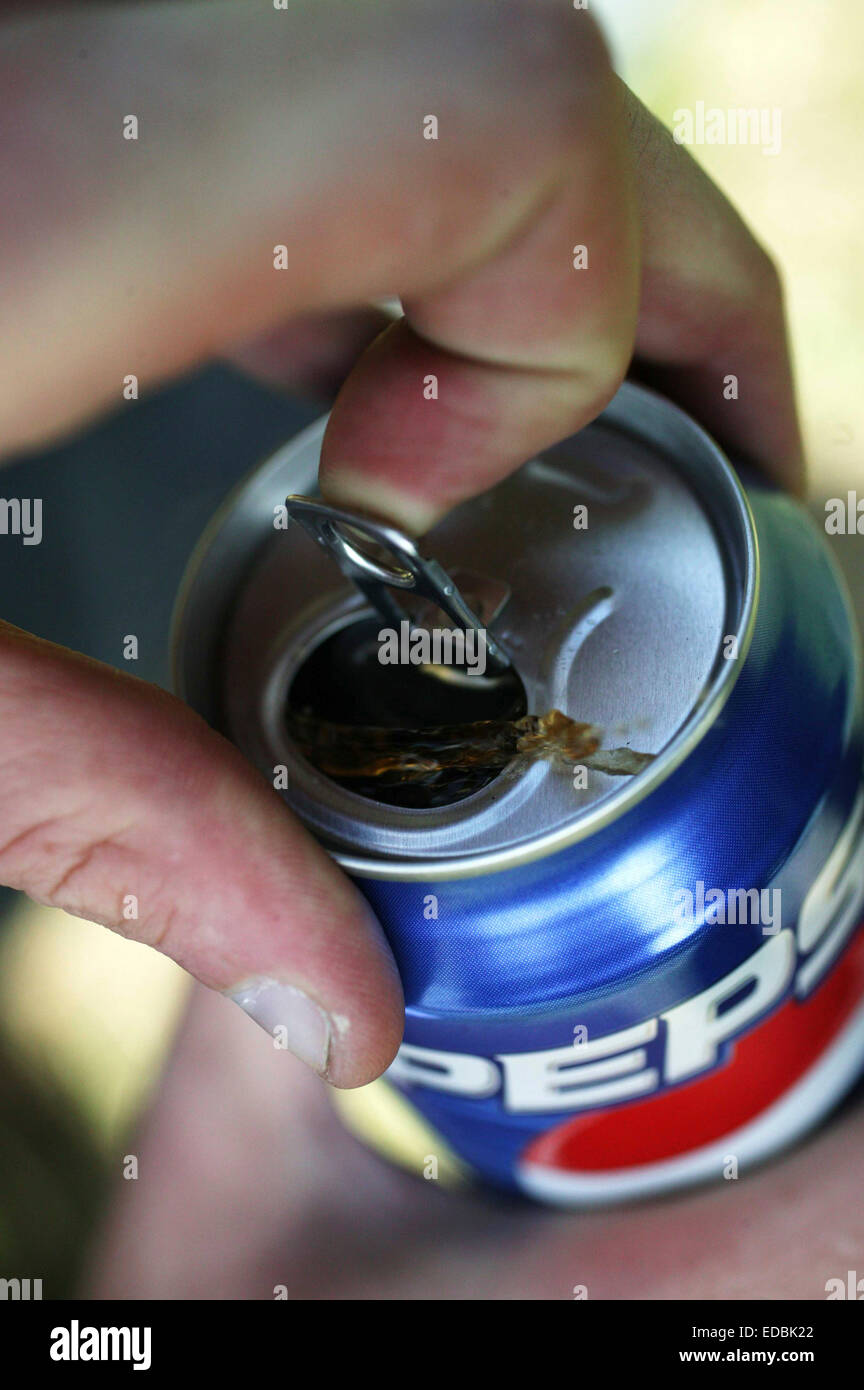 A man opening a can of Pepsi Cola Stock Photo - Alamy