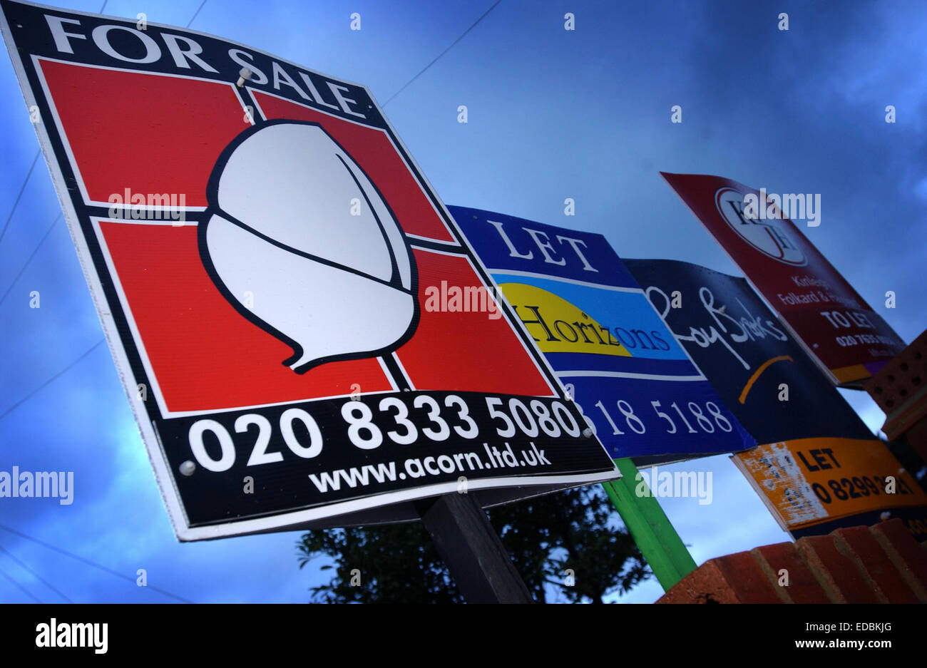 various For Sale and To Let signs outside houses Stock Photo - Alamy