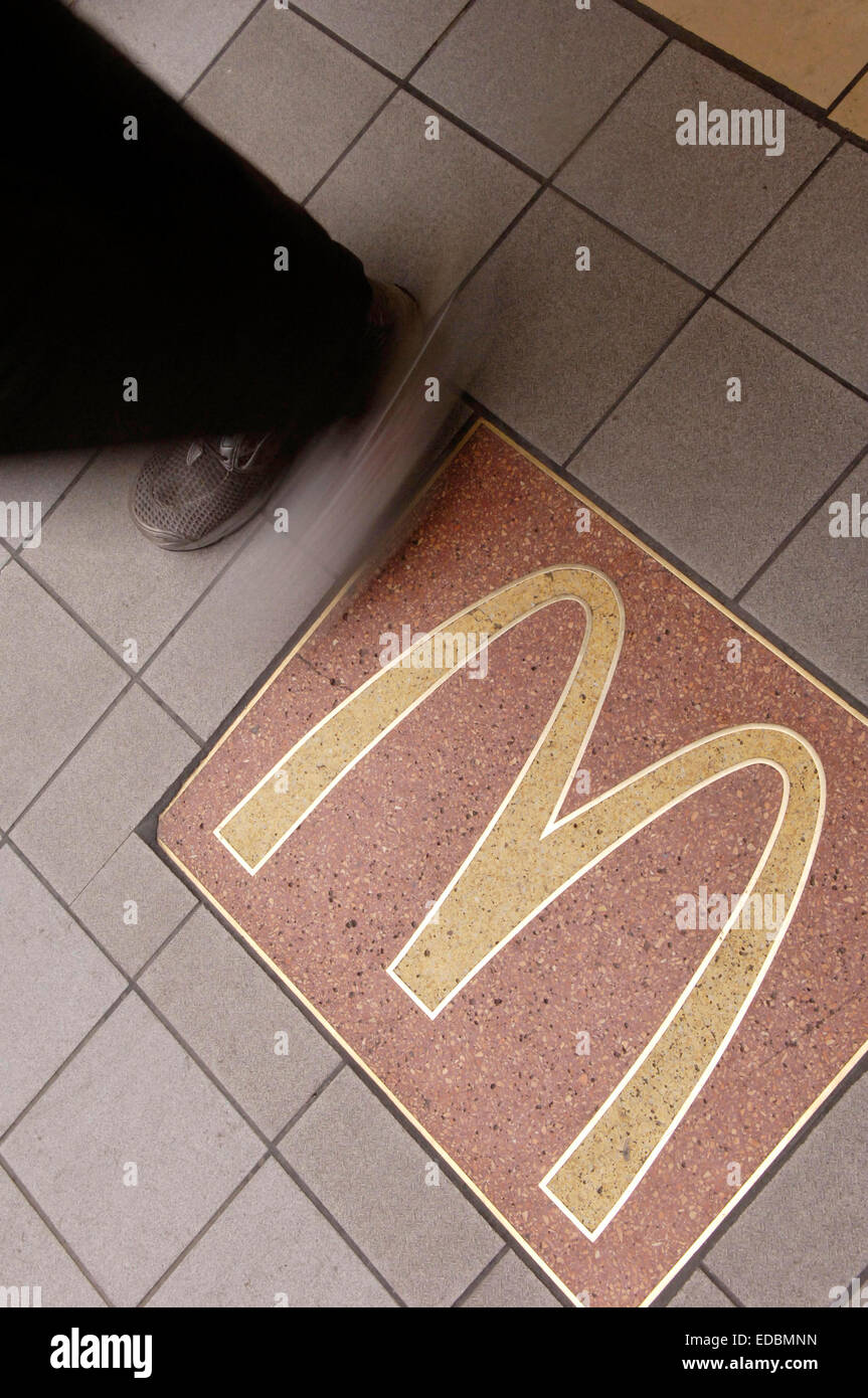 McDonald's floor sign logo outside the entrance to a McDonald's ...