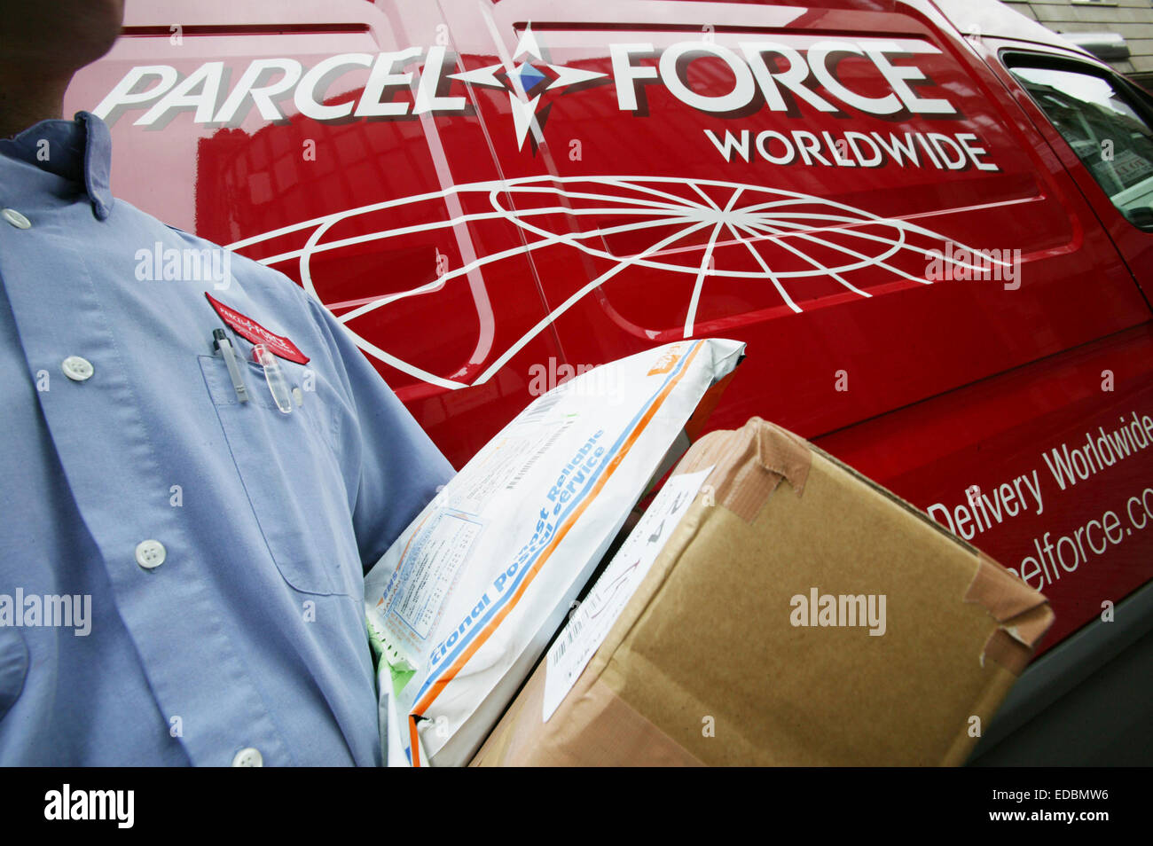 A Parcelforce worker delivering packages in London Stock Photo - Alamy