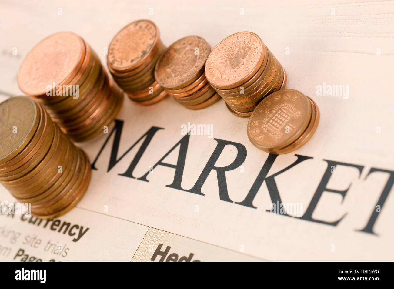 Various coins pictured on top of the FT Companies & Markets front page ...
