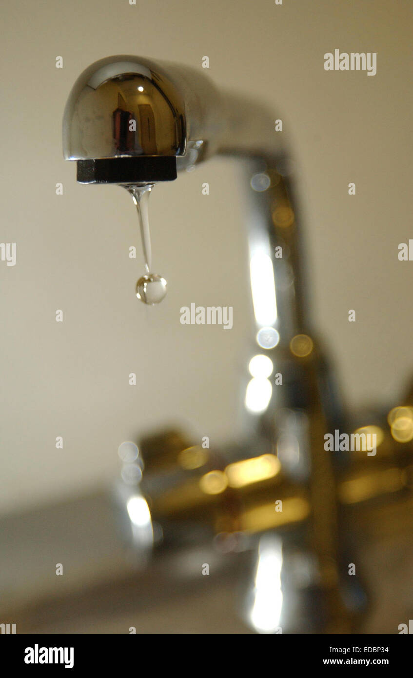 A tap with running water Stock Photo - Alamy