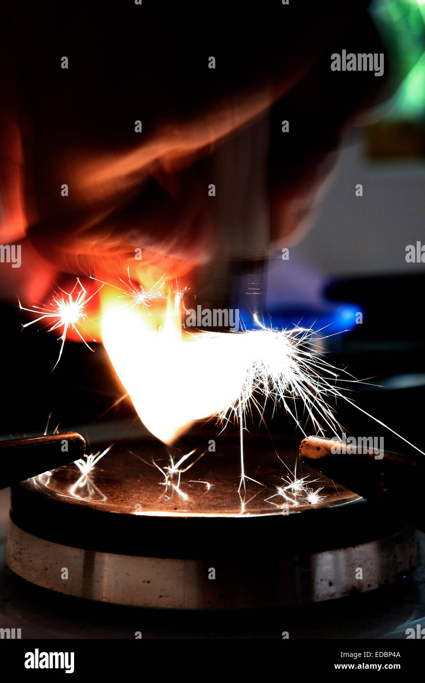 Picture shows a man's hand lighting a gas ring with a lighter Stock ...